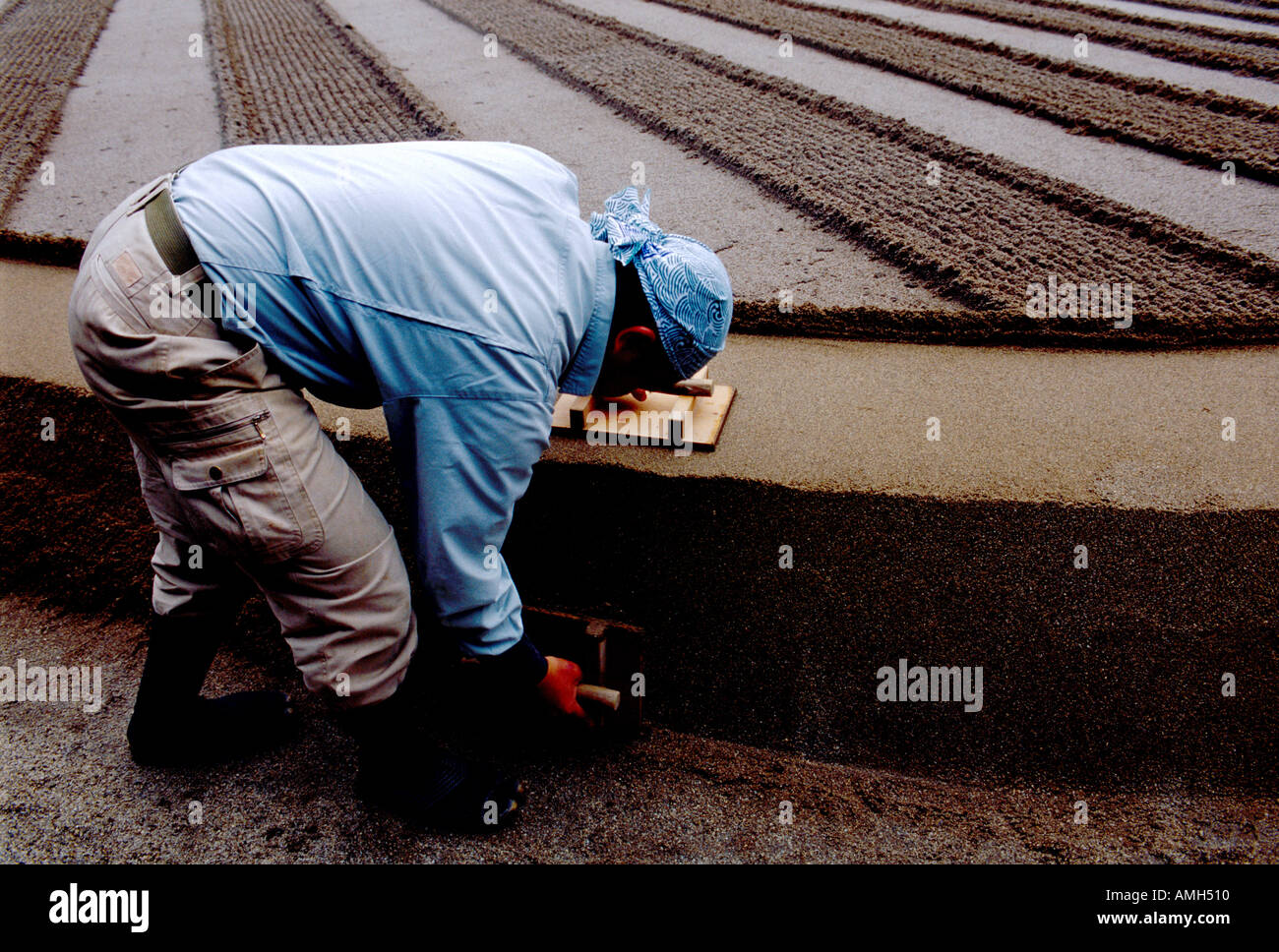 Japanese man raking garden hi-res stock photography and images - Alamy