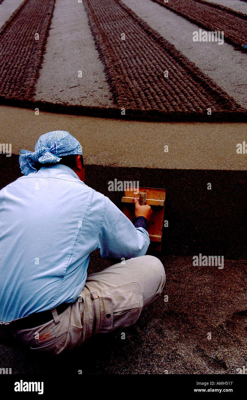 Japanese man raking garden hi-res stock photography and images - Alamy