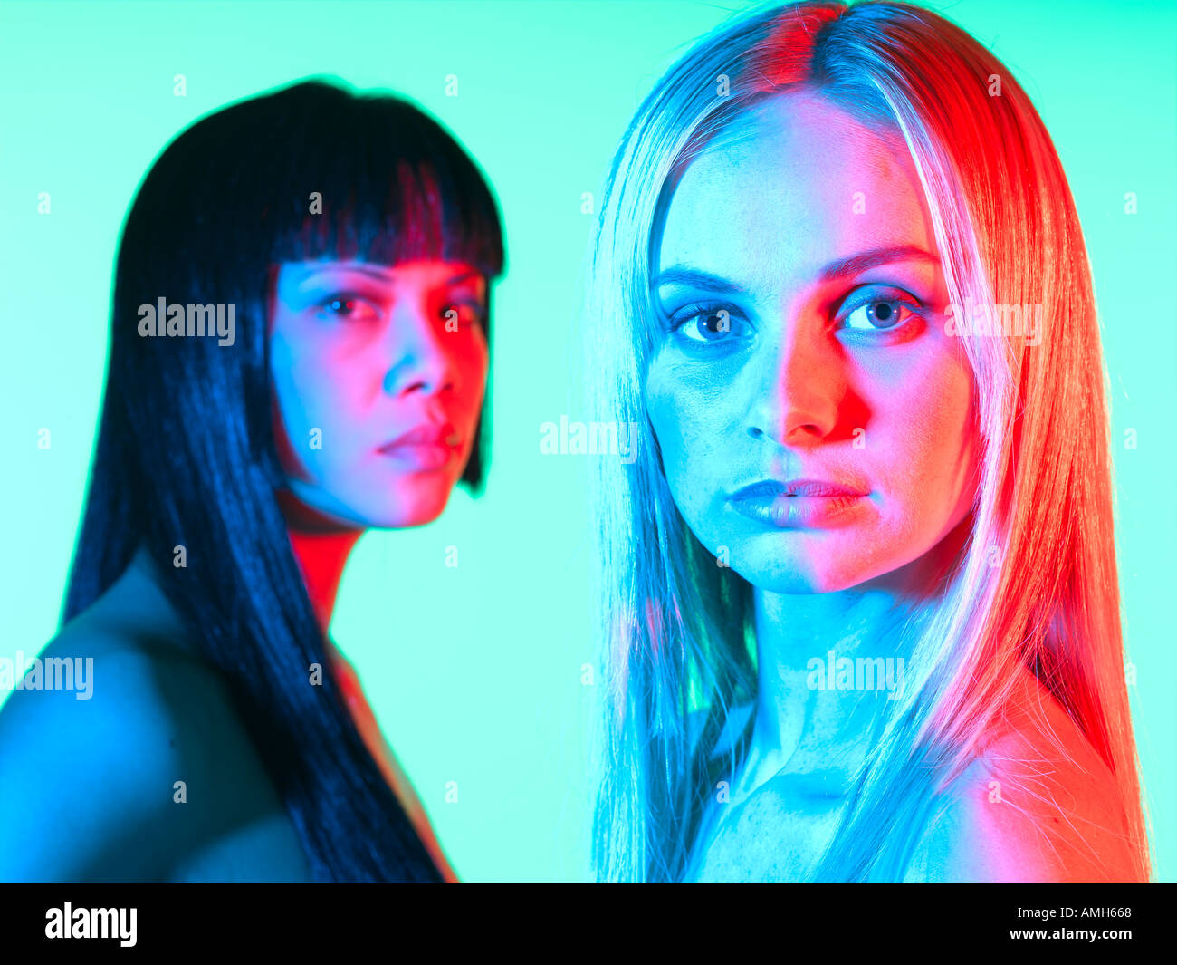 two women brightly coloured face Stock Photo - Alamy