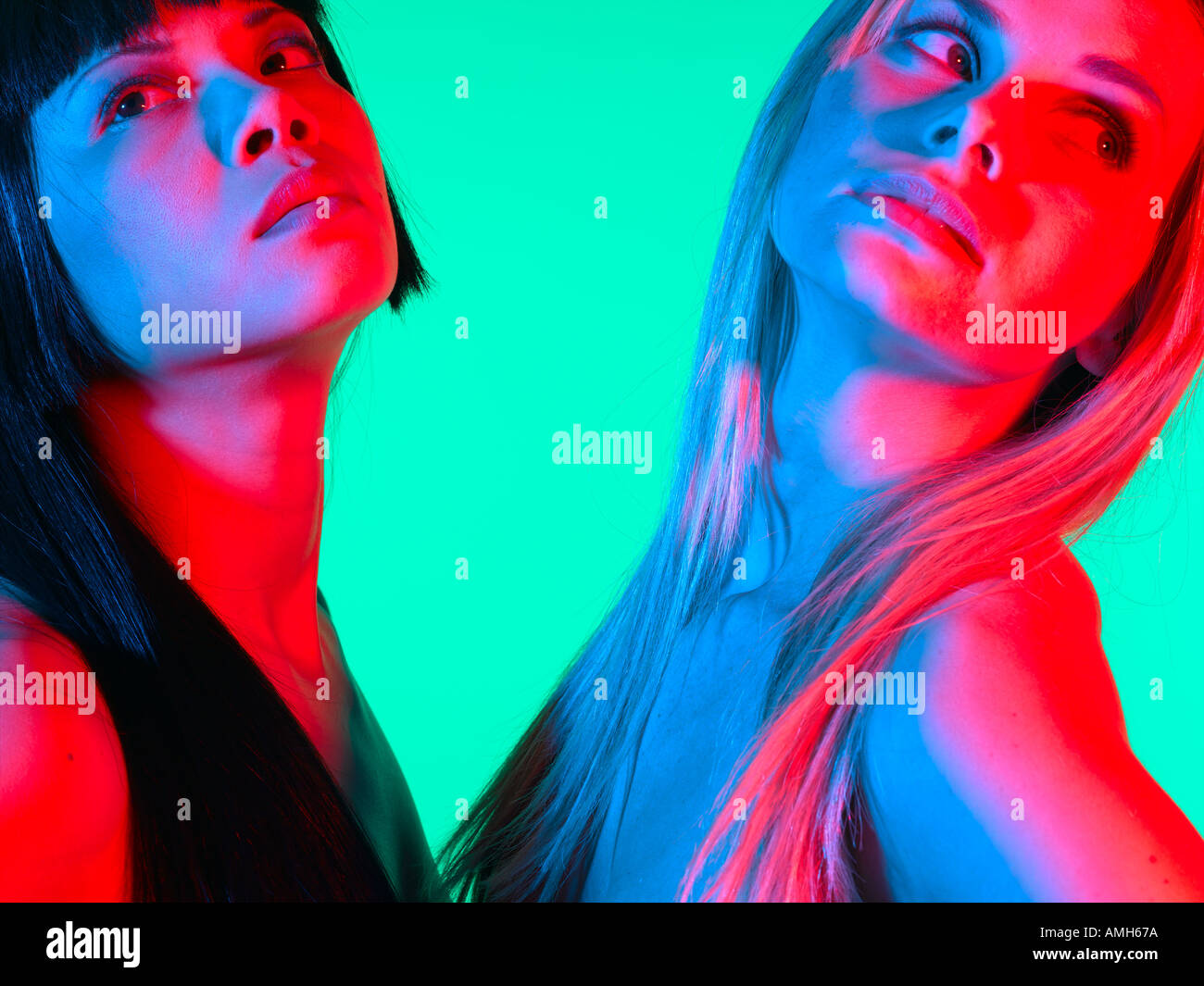 two women brightly coloured face Stock Photo - Alamy