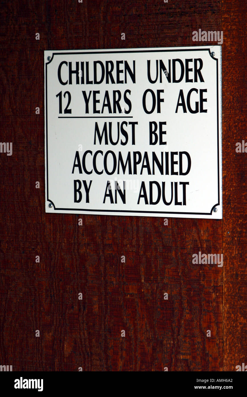 Sign warning adults must accompany children Stock Photo - Alamy