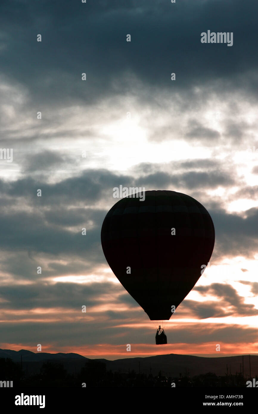Hot air balloon rising at dawn during the Reno Balloon Races in Nevada ...