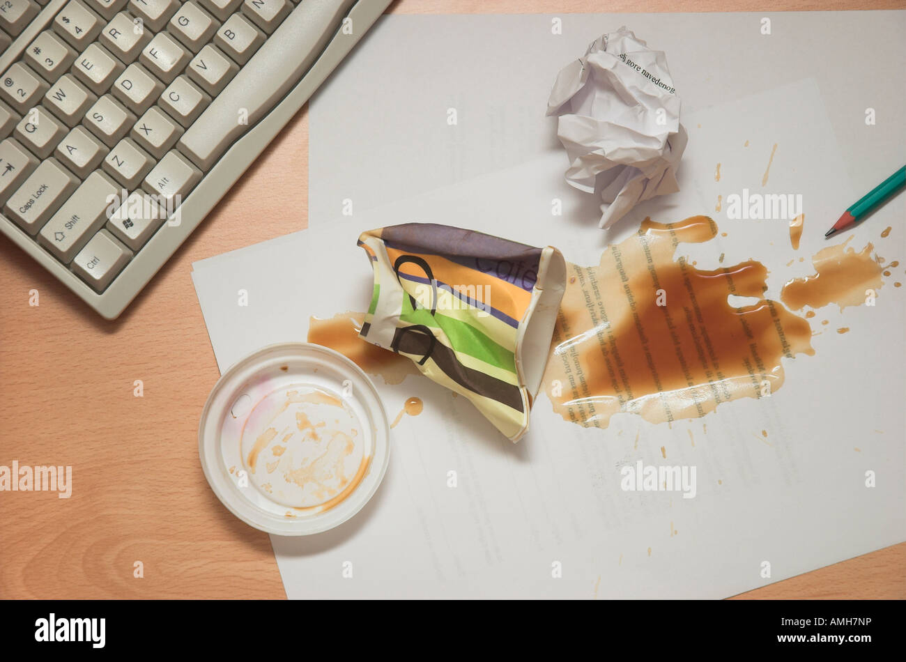 Crushed coffee cup and spilt coffee over paper work Stock Photo - Alamy