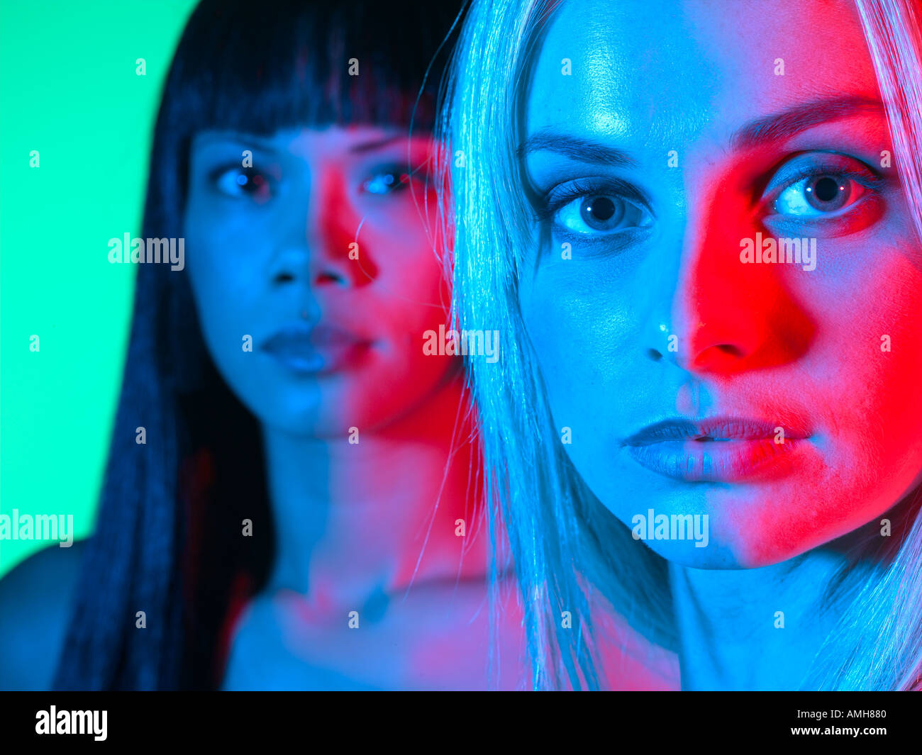 two women brightly coloured face Stock Photo - Alamy