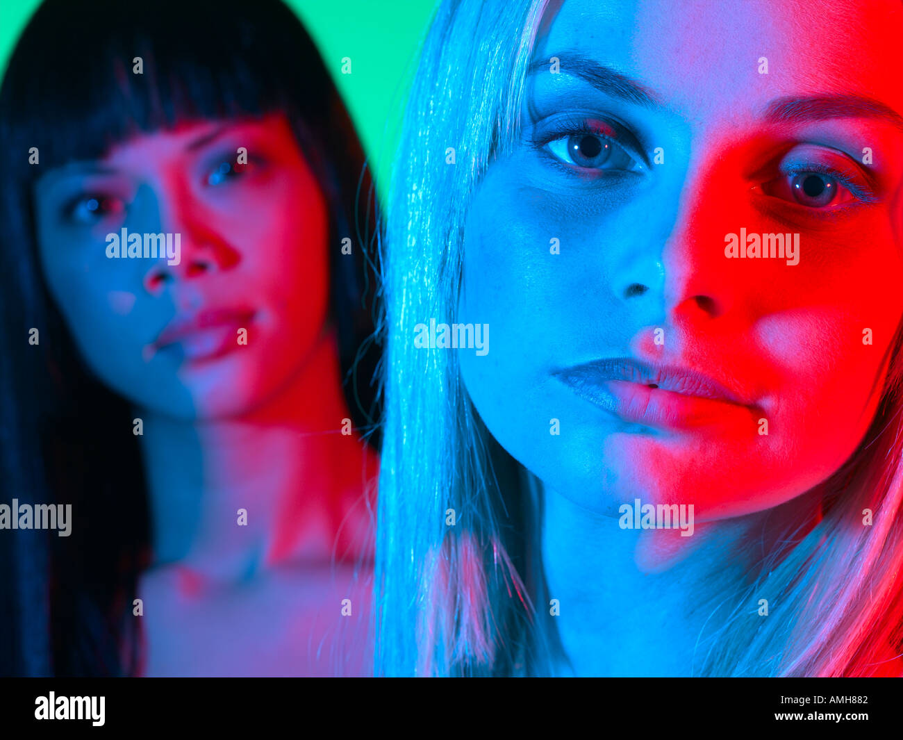 two women brightly coloured face Stock Photo - Alamy