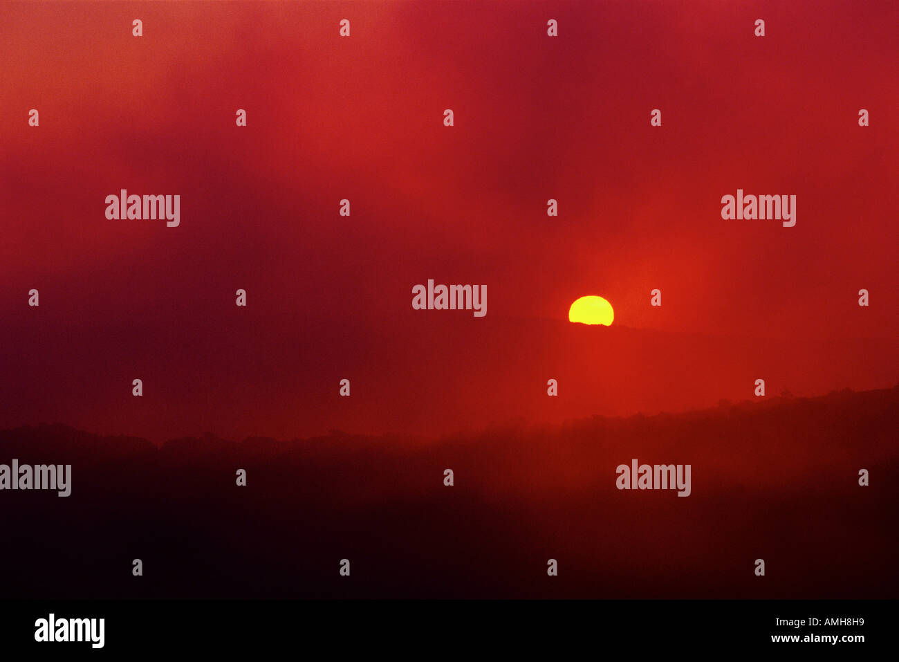 Big red sun setting through hi-res stock photography and images - Alamy
