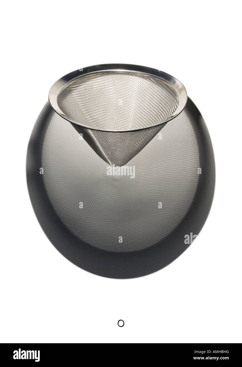 A sieve with a hard shadow which when view abstractedly form the letter ...