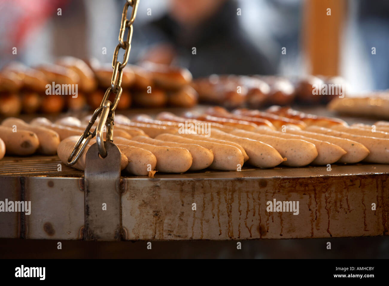 rostbratwurst bratwurst sausages cooking on schwenkgrill christmas ...