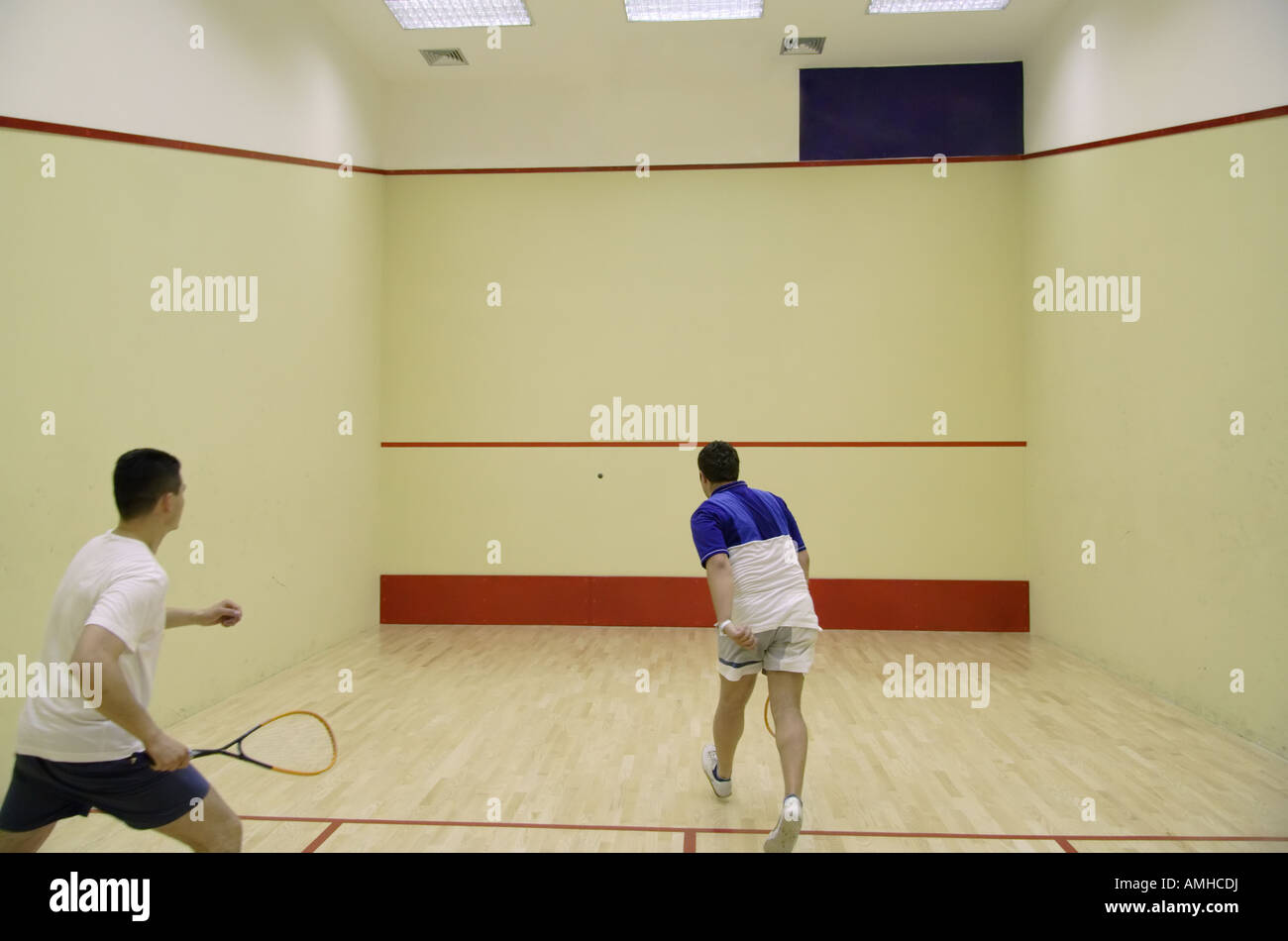 Two people playing squash Stock Photo - Alamy