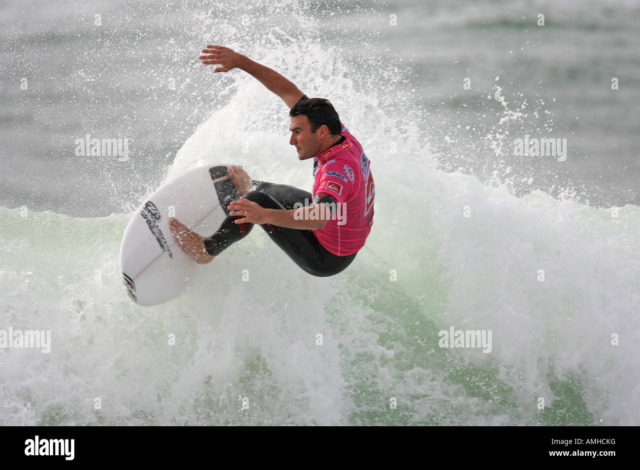 A Surfer rides a Wave Stock Photo - Alamy