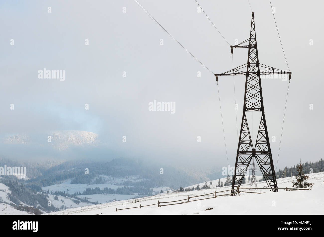 winter mountain landscape with high voltage current line Stock Photo ...