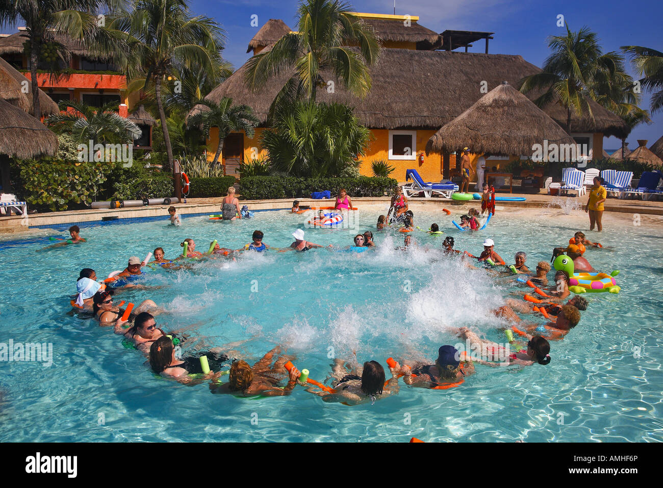 holidaymakers exercise in a pool in mexico Stock Photo - Alamy