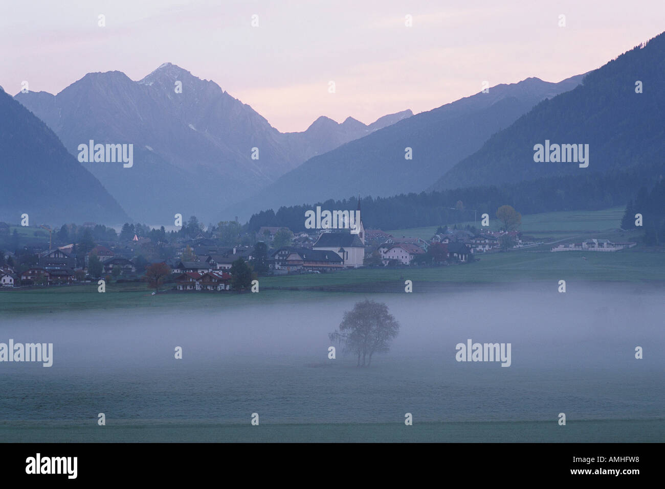 Fog over Field at Dawn, Dolomites, Italy Stock Photo - Alamy