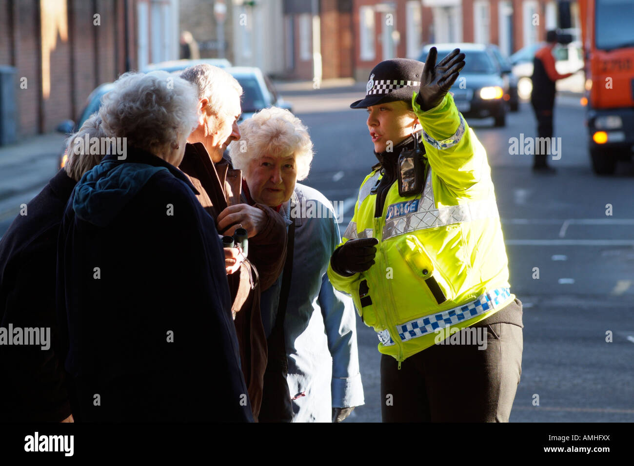 Policeman policewoman giving directions woman hi-res stock photography ...