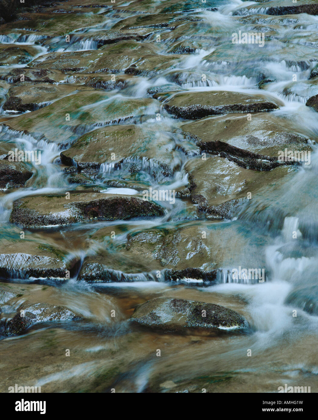 Water flowing through rocks Stock Photo - Alamy