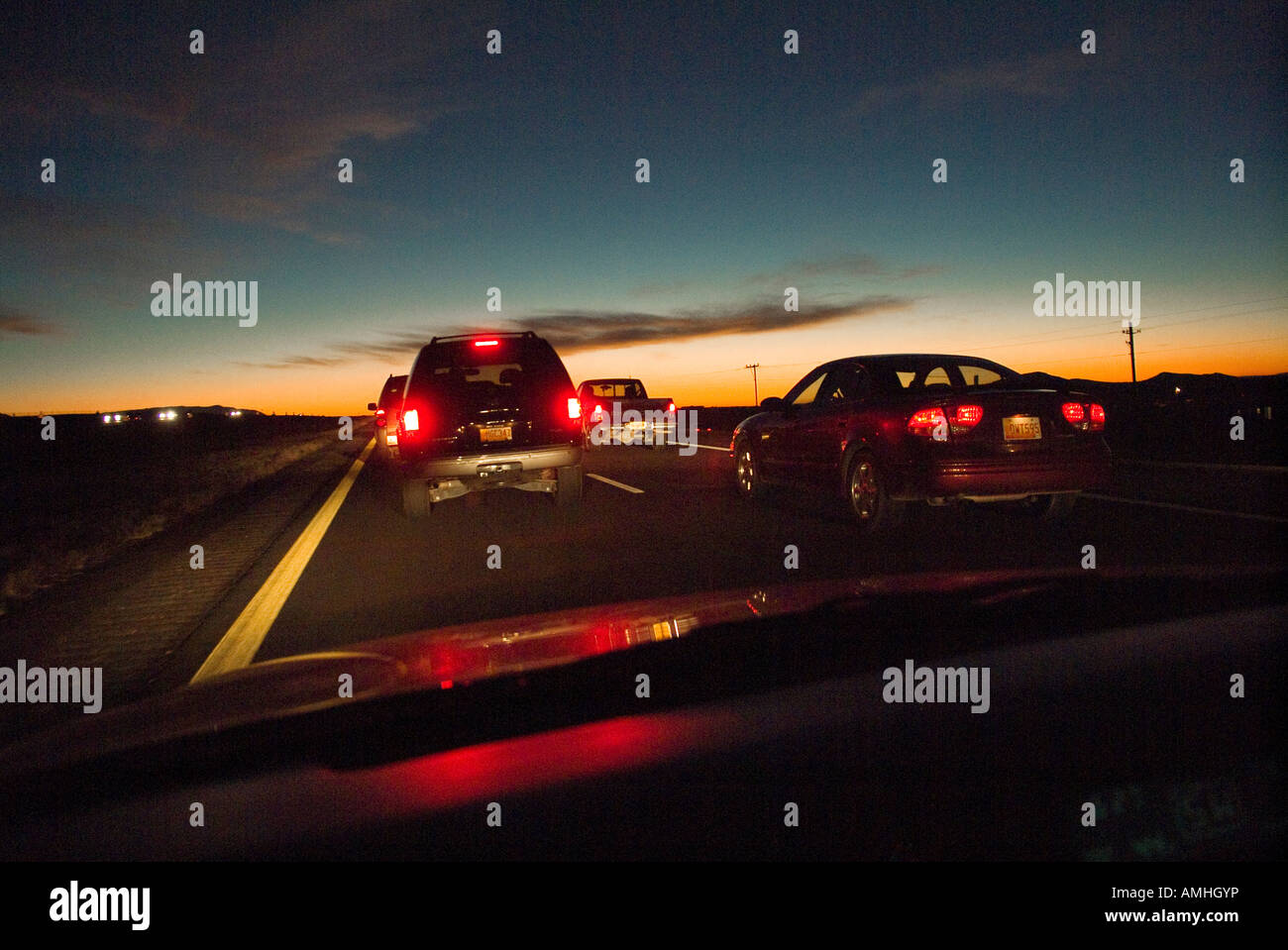 Car stopped on freeway at dusk Stock Photo - Alamy