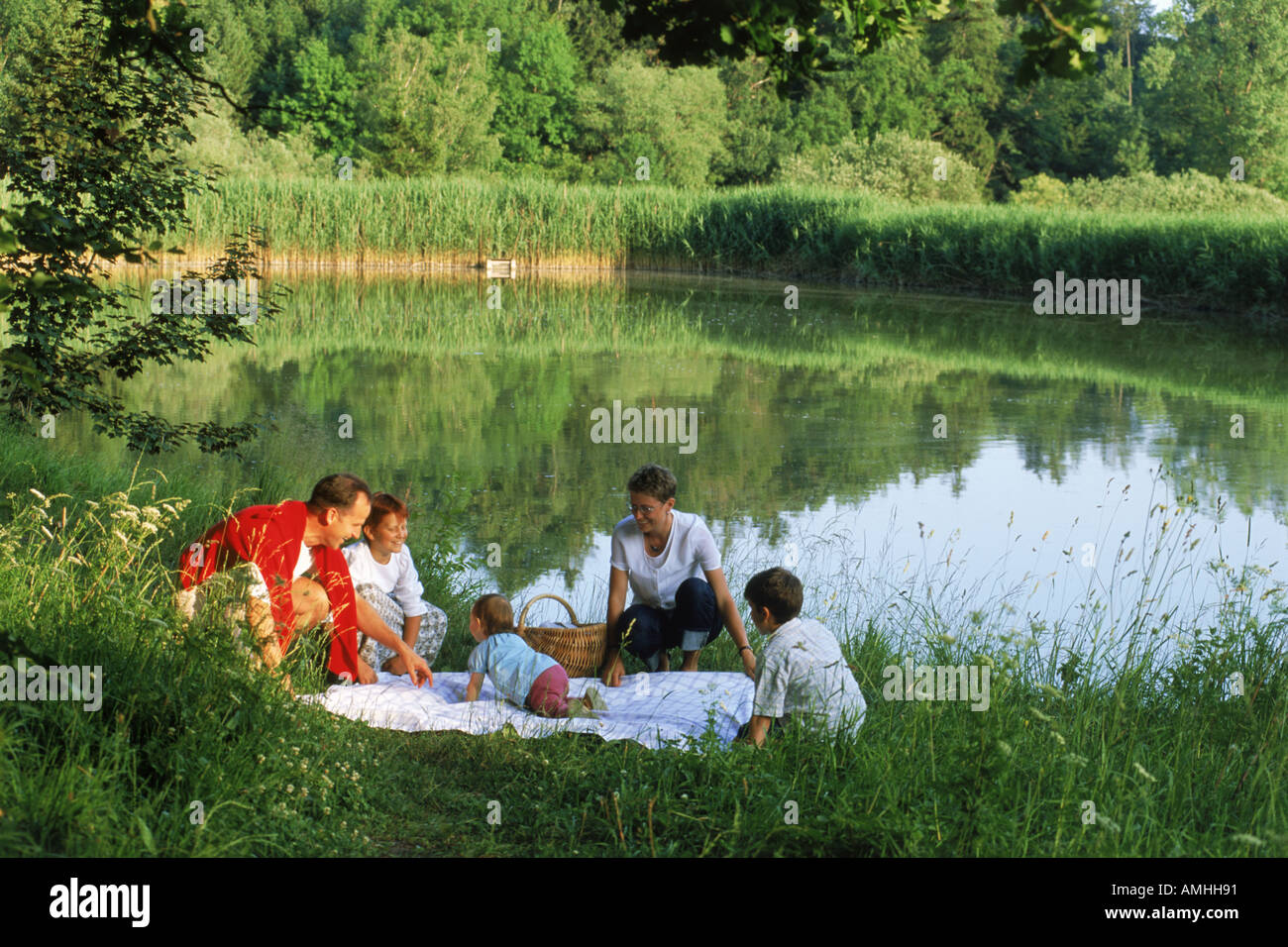 Family picnic near countryside pond in Bavaria, Germany Stock Photo - Alamy