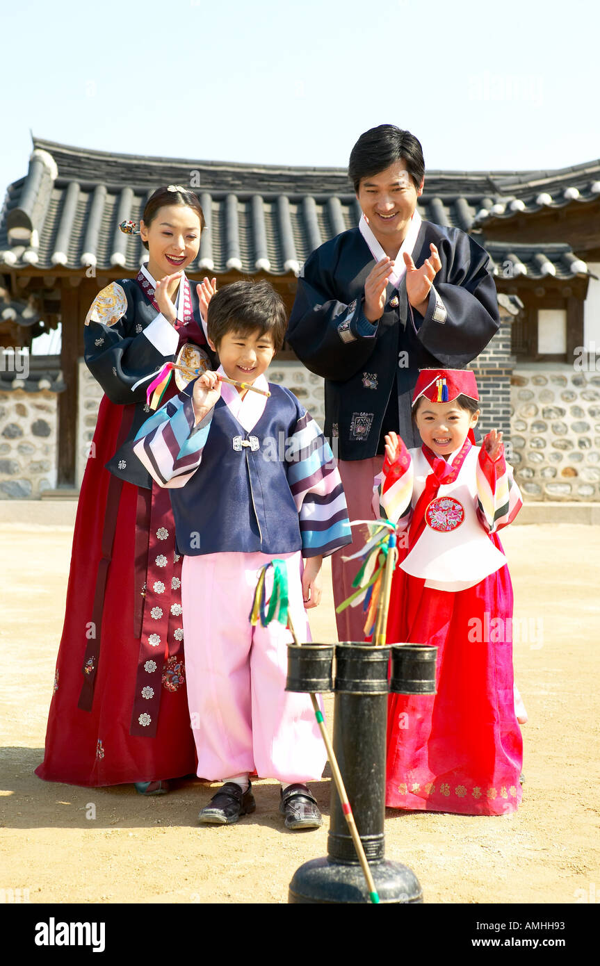 A family in Hanbok playing the Korean traditional game Stock Photo - Alamy
