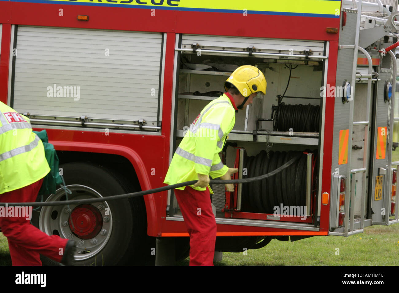 Fire engine and firemen at an event in England UK 2005 Stock Photo - Alamy