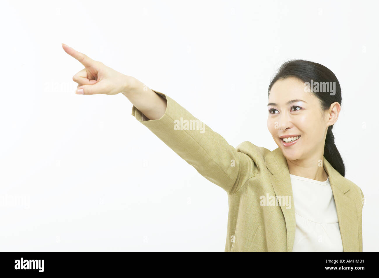 A woman pointing at something Stock Photo - Alamy