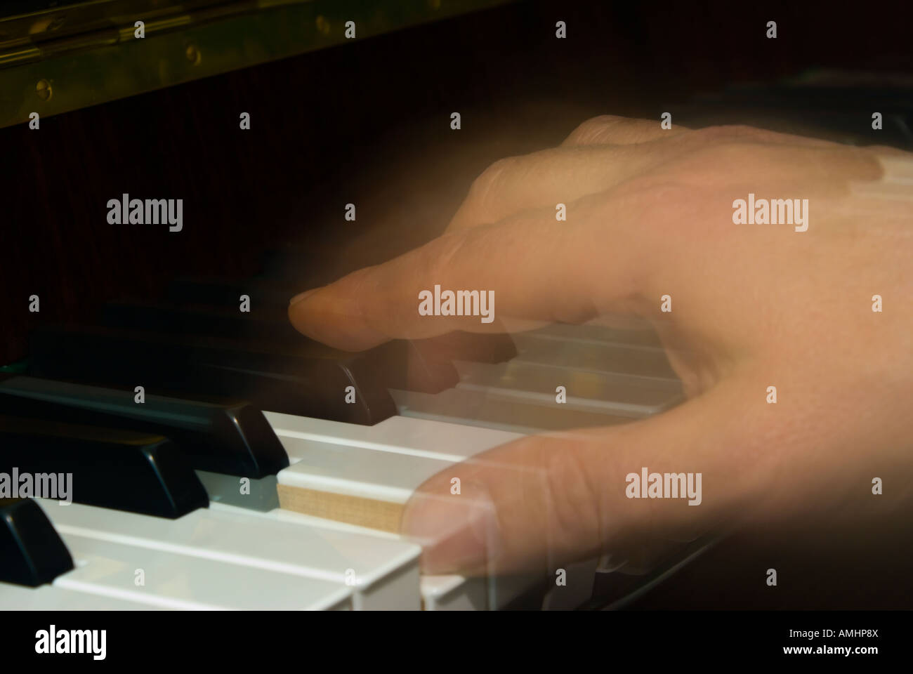 Playing the piano with the right hand Stock Photo - Alamy