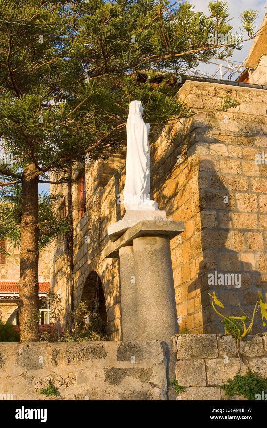 Virgin Mary statue by a stone building Byblos Lebanon Stock Photo - Alamy