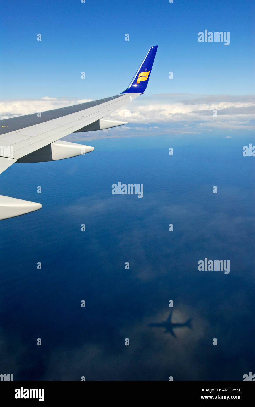 Passenger view from Iceland Air plane flying above Iceland plane shadow ...