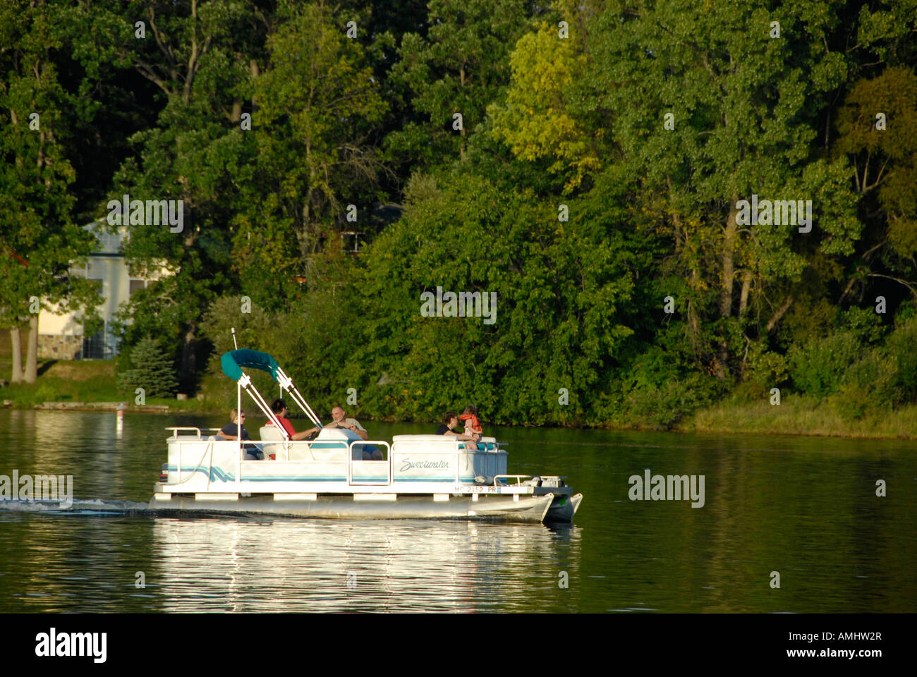 Families enjoy water activities at Waterloo State Park on Portage Lake ...