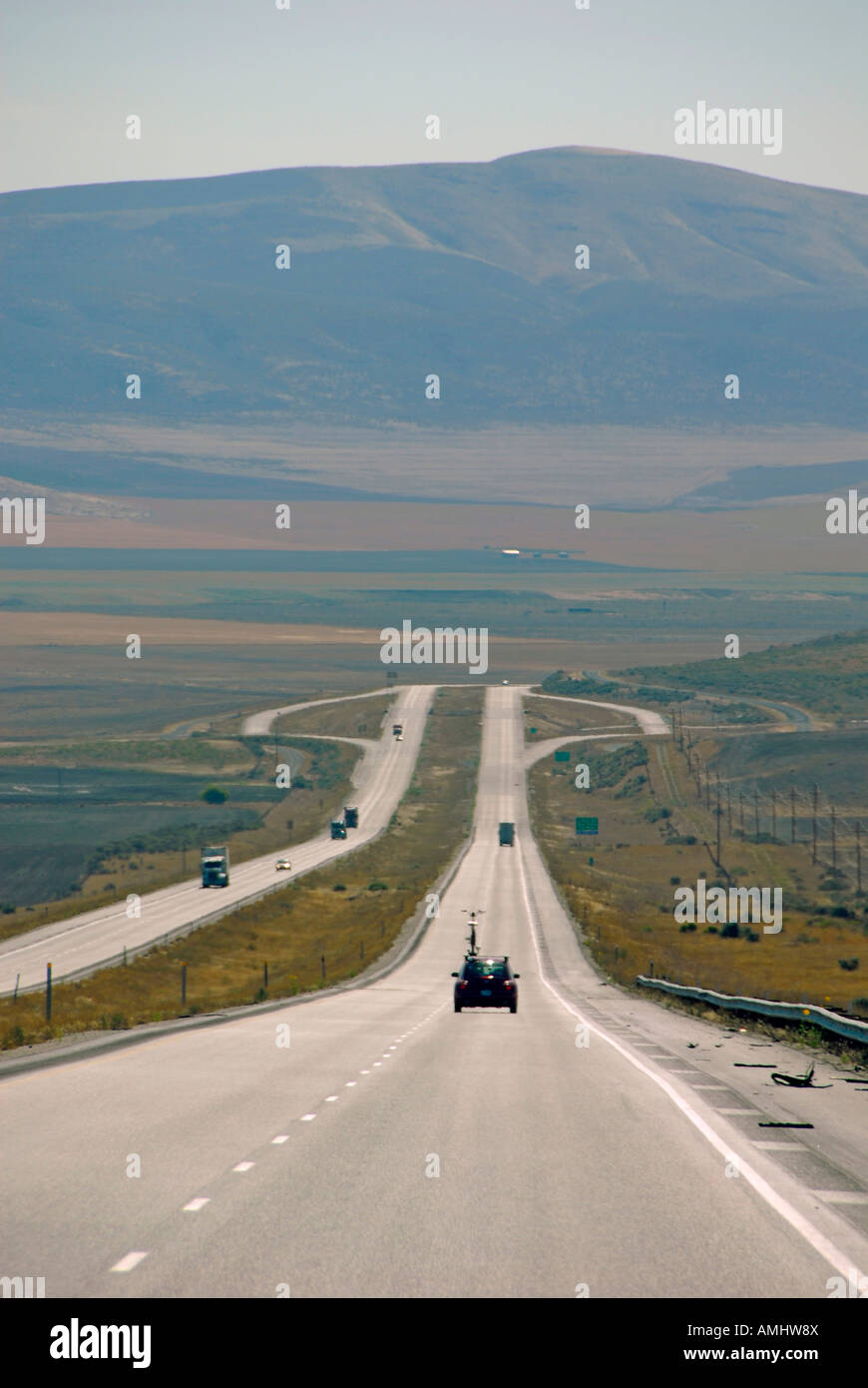 Driving on Utah Interstate 80 freeway with mountain on horizon Stock ...