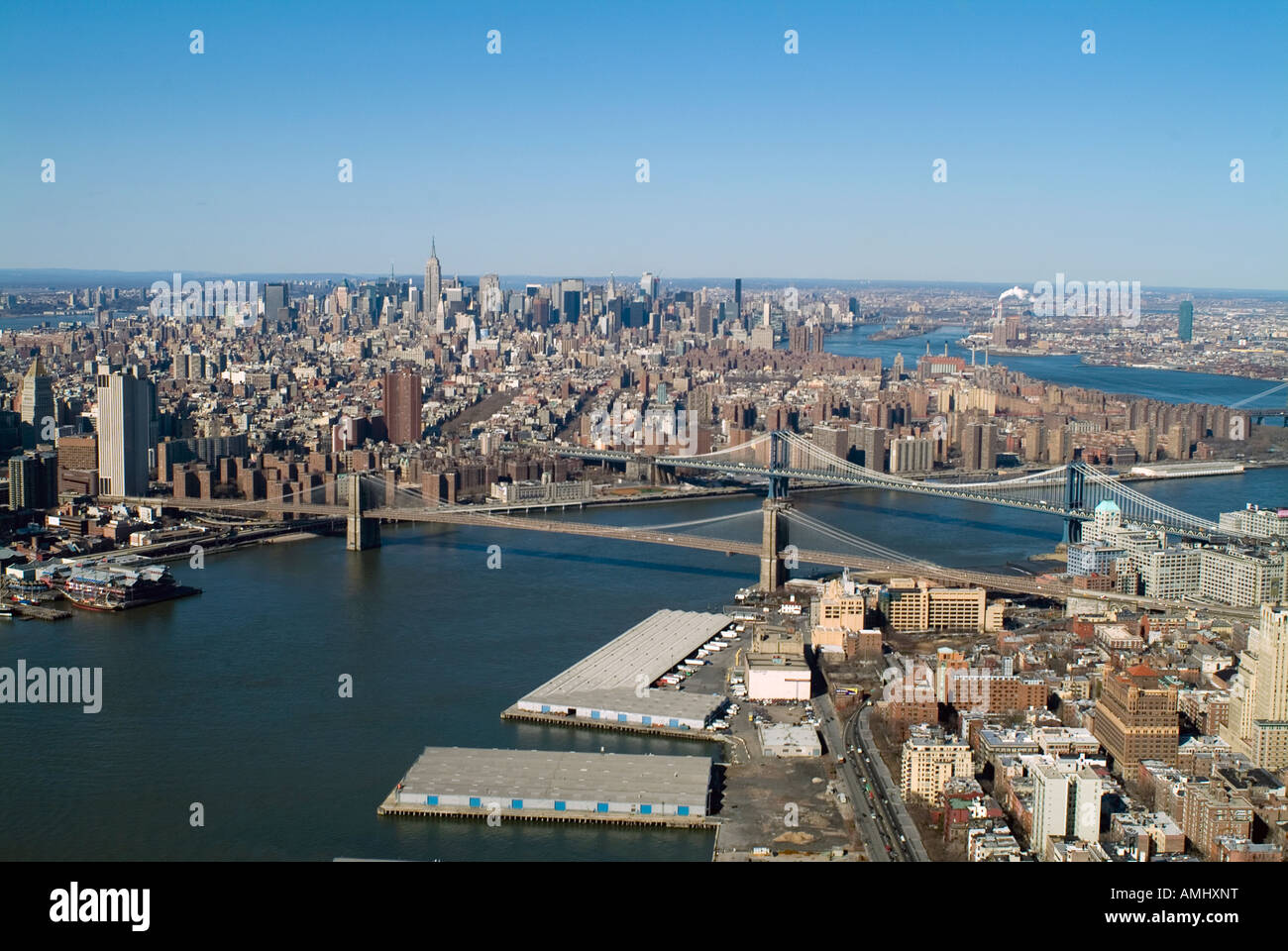 aerial view above East river with Brooklyn and Williamsburg bridges Manhattan New York city ...