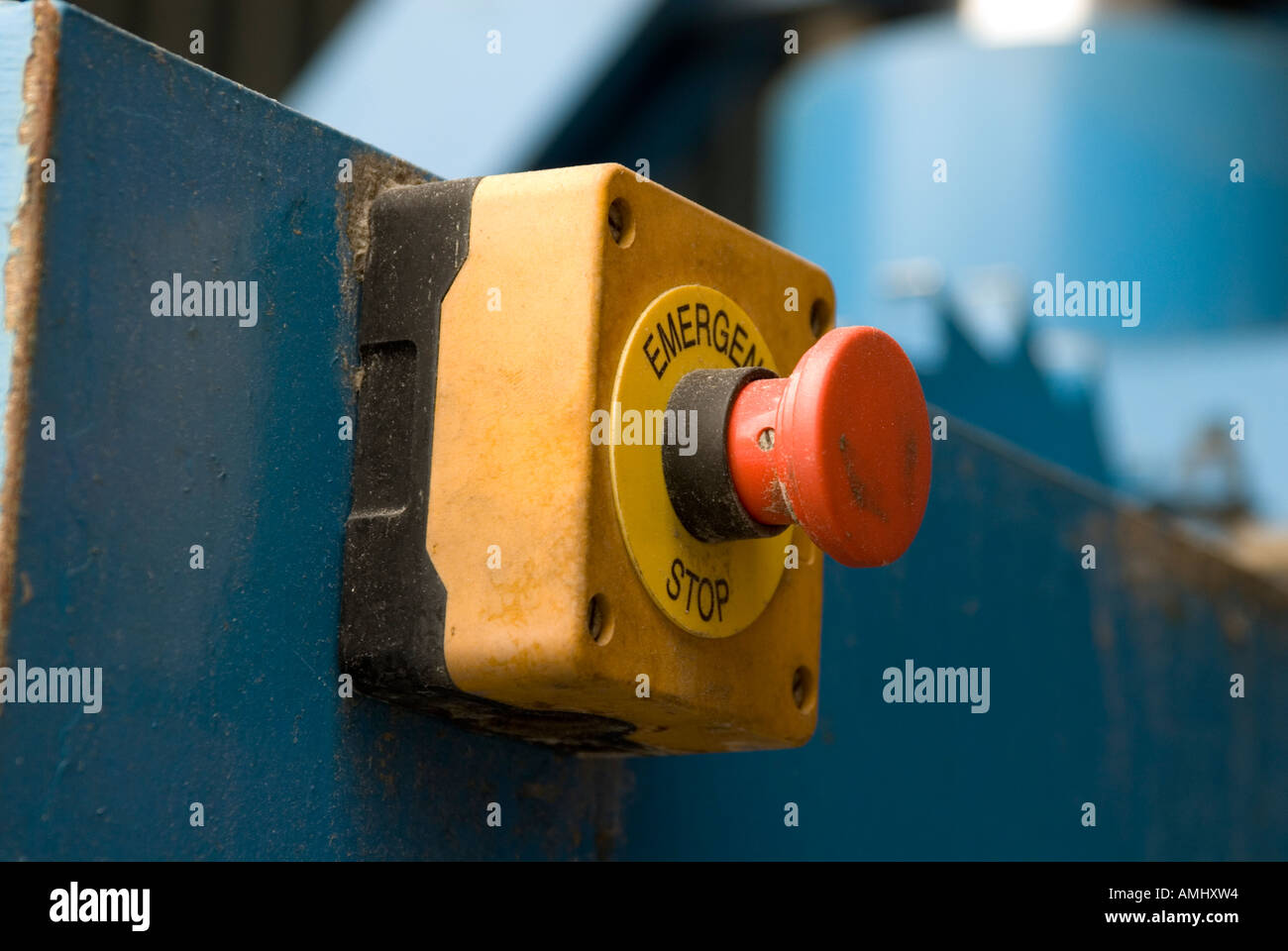 Red emergency stop button on industrial machine in factory England UK ...