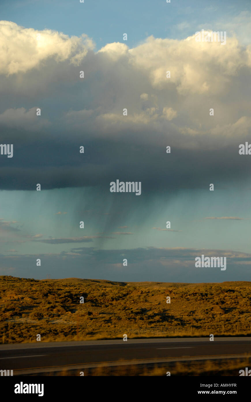 Rain falling from a cloud formation in the Utah desert Stock Photo - Alamy