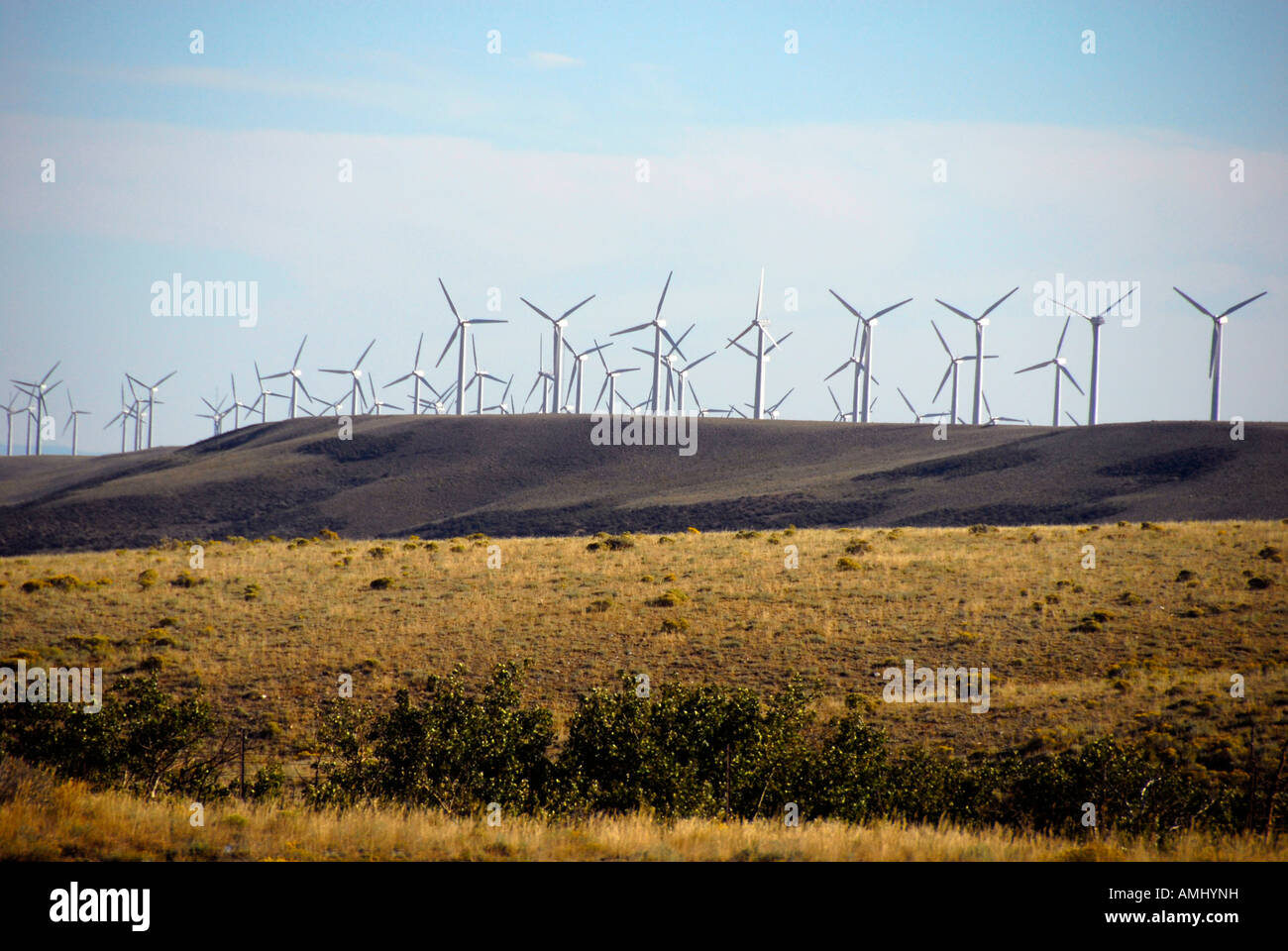 Wind powered turbine windmills in Wyoming WY Stock Photo - Alamy