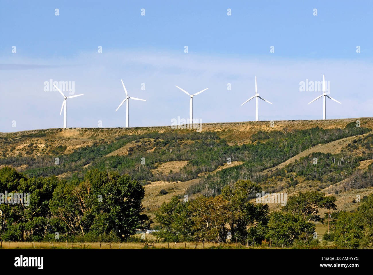 Wind powered turbine windmills in Wyoming WY Stock Photo - Alamy