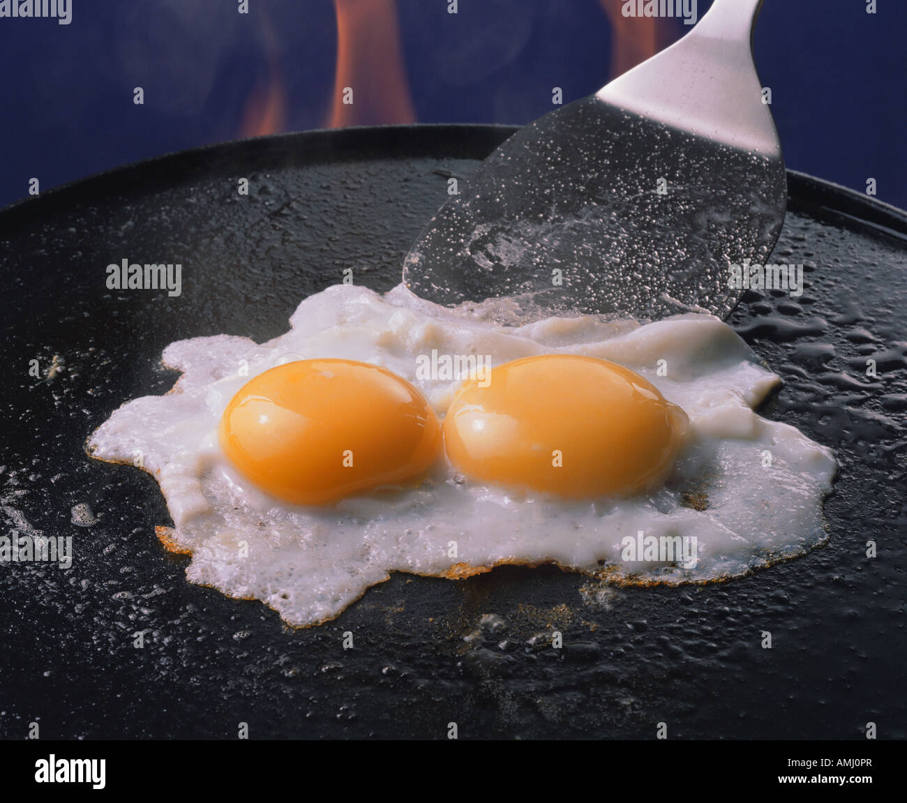 Fried eggs cooking pan hi-res stock photography and images - Alamy