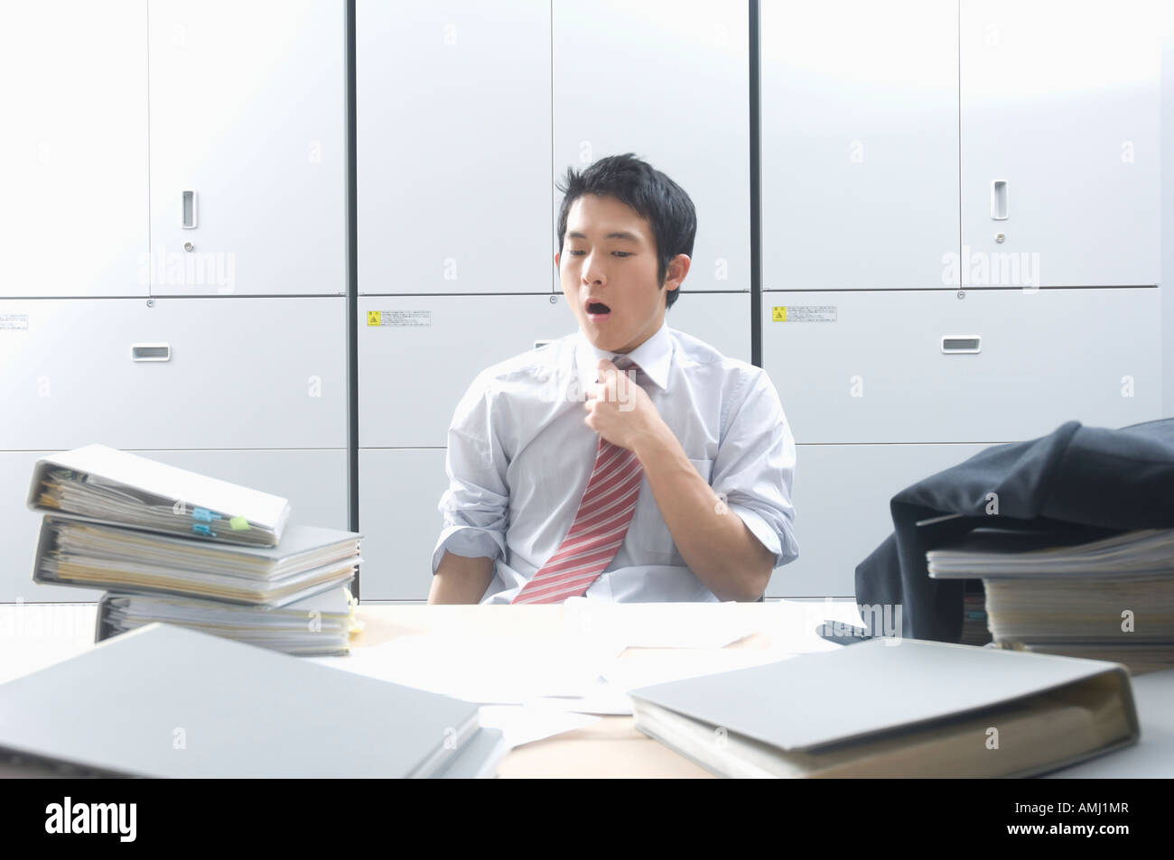Businessman working late Stock Photo - Alamy