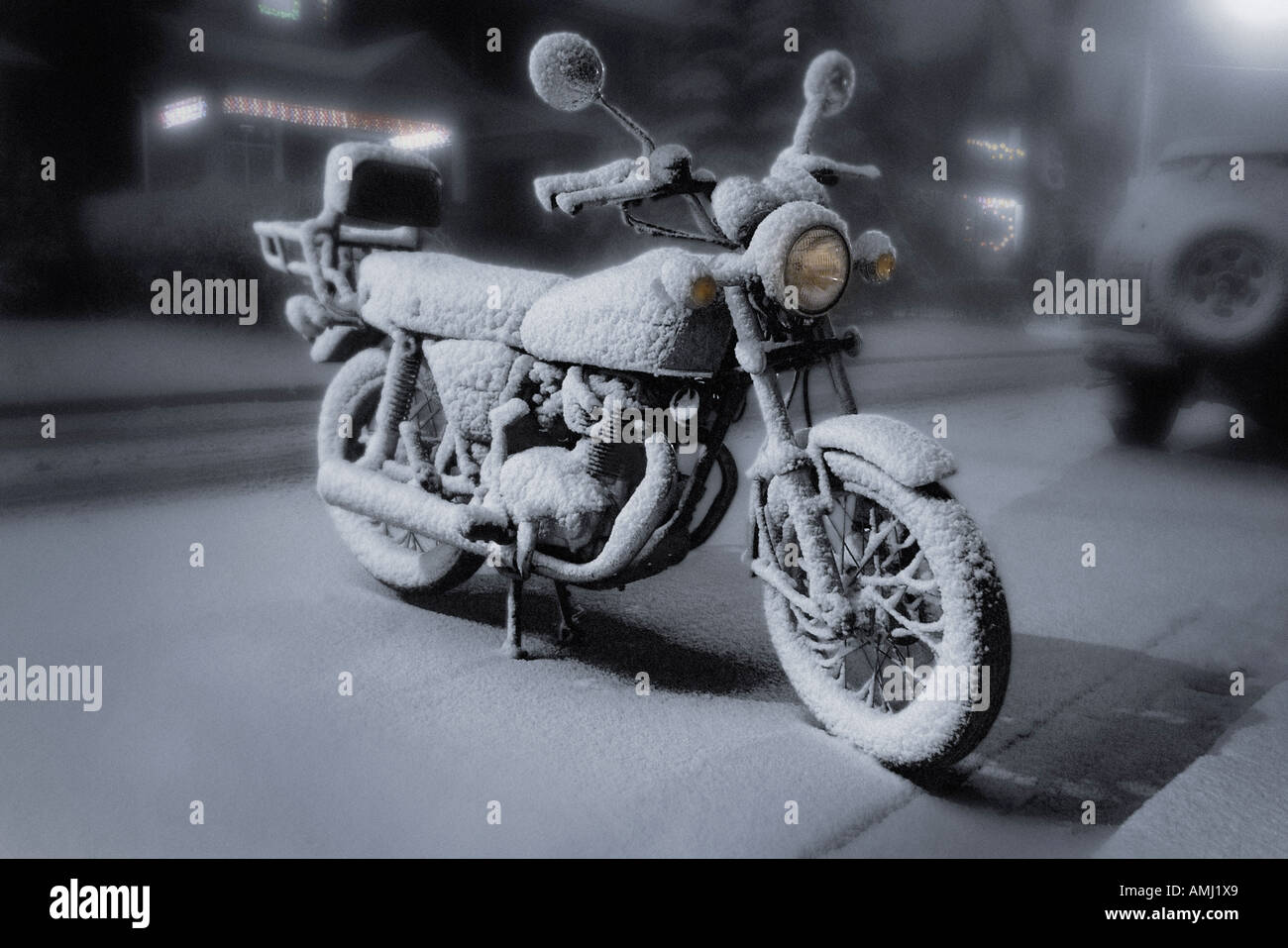 Snow Covered Motorcycle on Street Stock Photo - Alamy