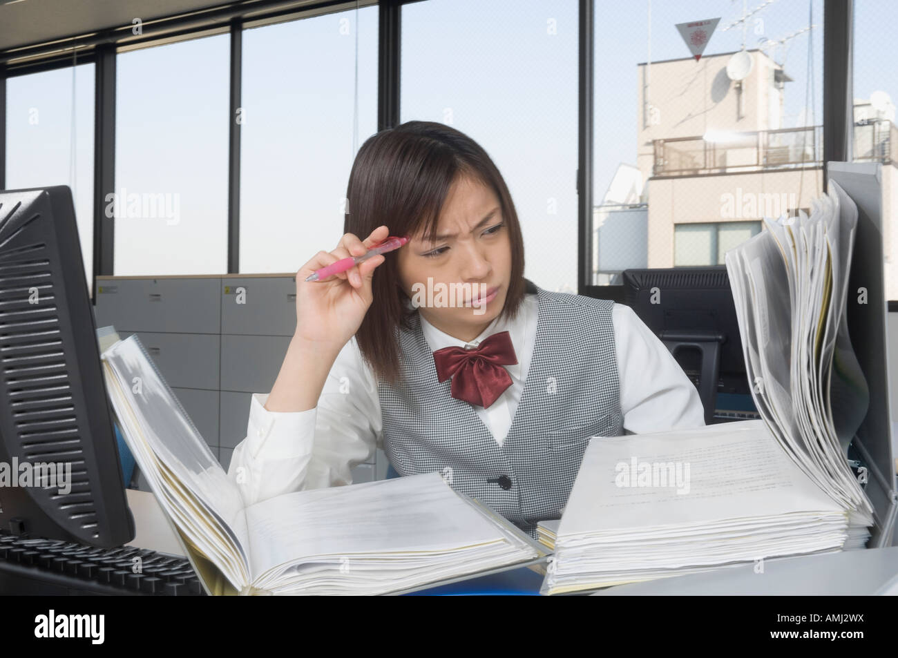 Office worker looking through files Stock Photo - Alamy