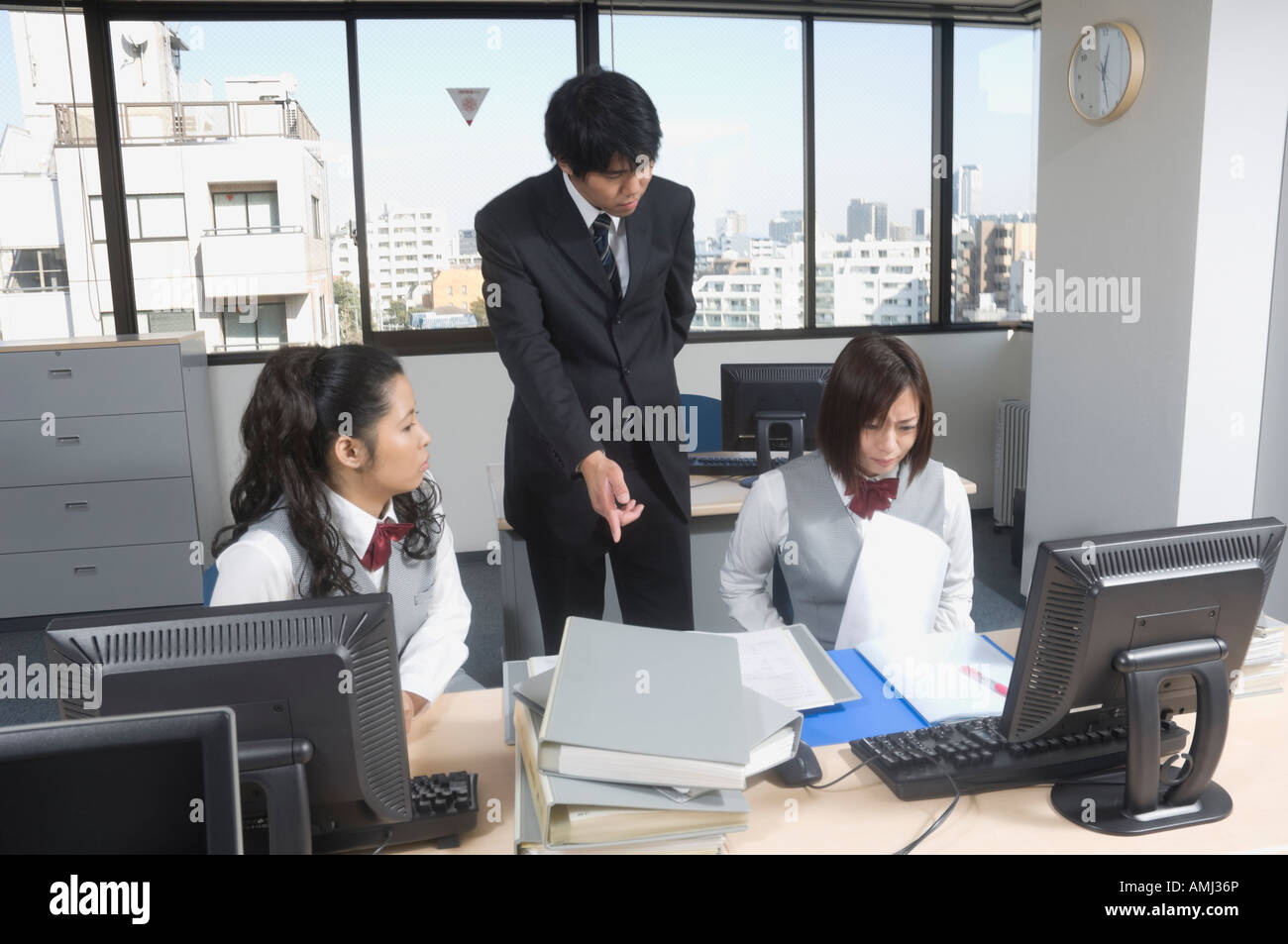 Manager scolding office worker Stock Photo - Alamy