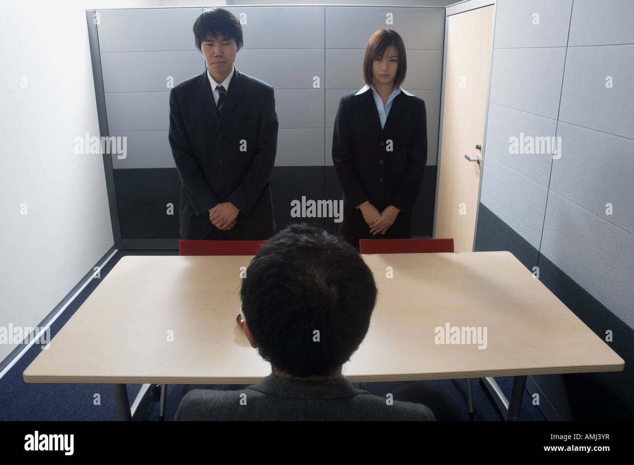 Two business people standing Stock Photo - Alamy