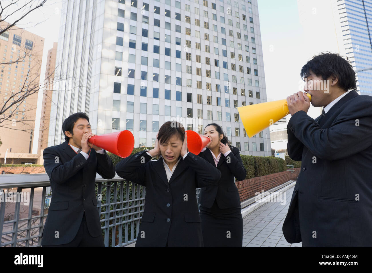 Group of business people shouting at colleague Stock Photo - Alamy