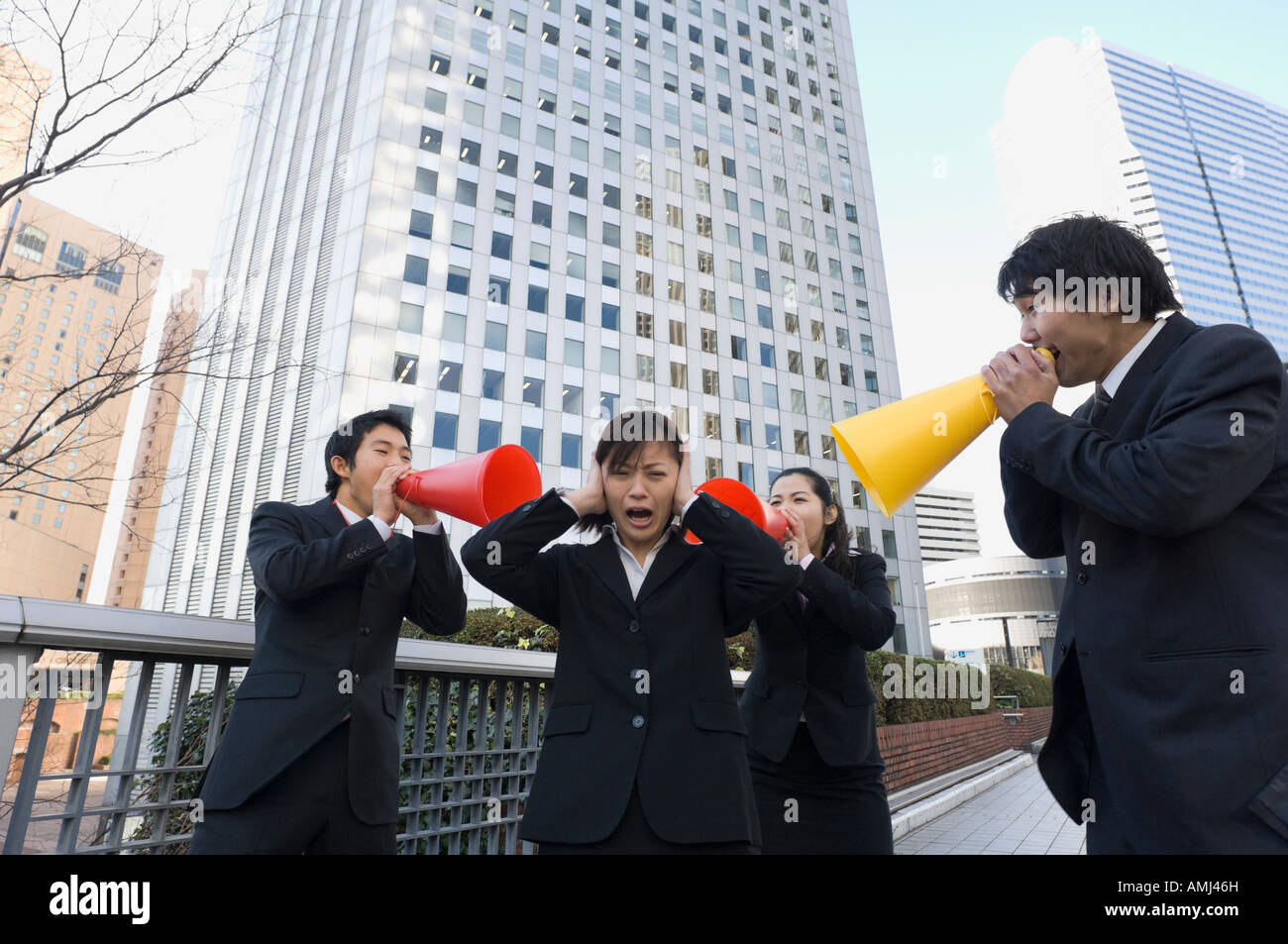 Group of business people shouting at colleague Stock Photo - Alamy