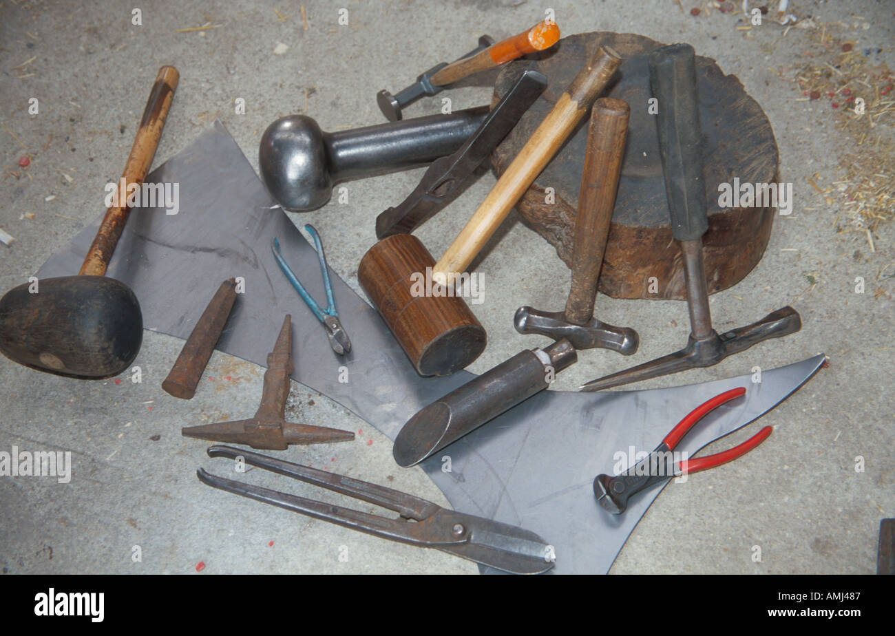 A traditional craftsman making suits of armour some of the tools he ...