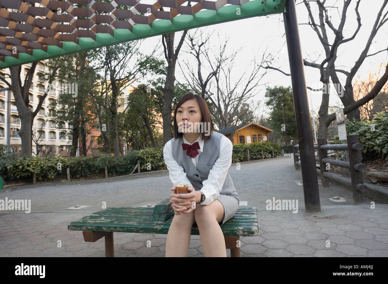 Office worker sitting on bench Stock Photo - Alamy