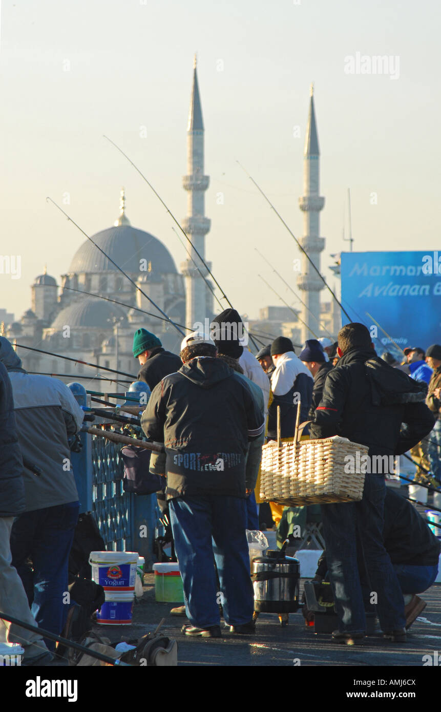 ISTANBUL Line fishing from the Galata Bridge on the Golden Horn, with ...