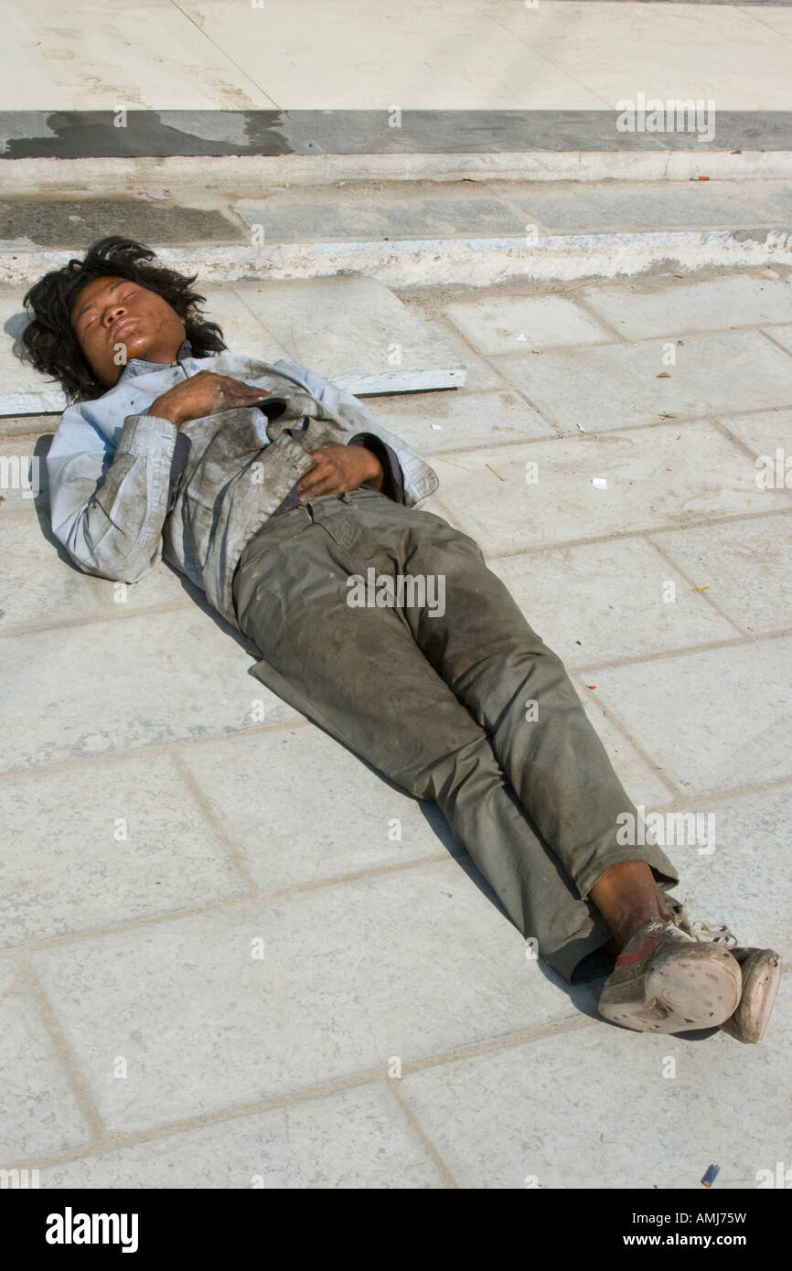 Homeless Chinese Man Sleeping on the Street, Yangshuo CHina Stock Photo ...
