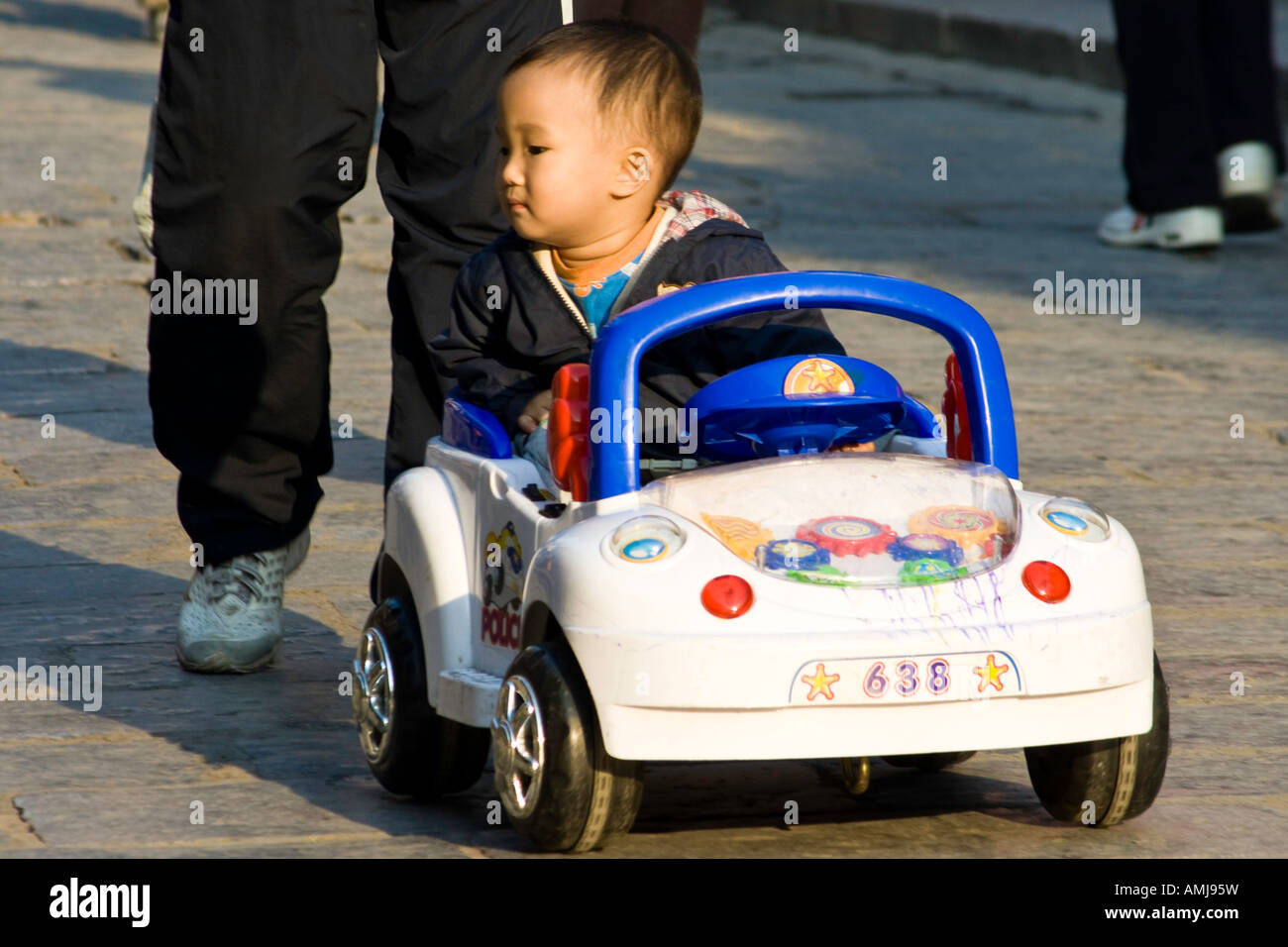 Young Chinese Boy Driving a Miniature Car West Street or Xi Jie ...