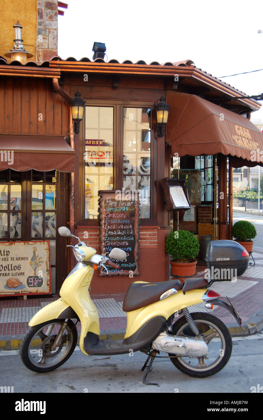 characteristic restaurant front with moped Calella Spain Stock Photo ...