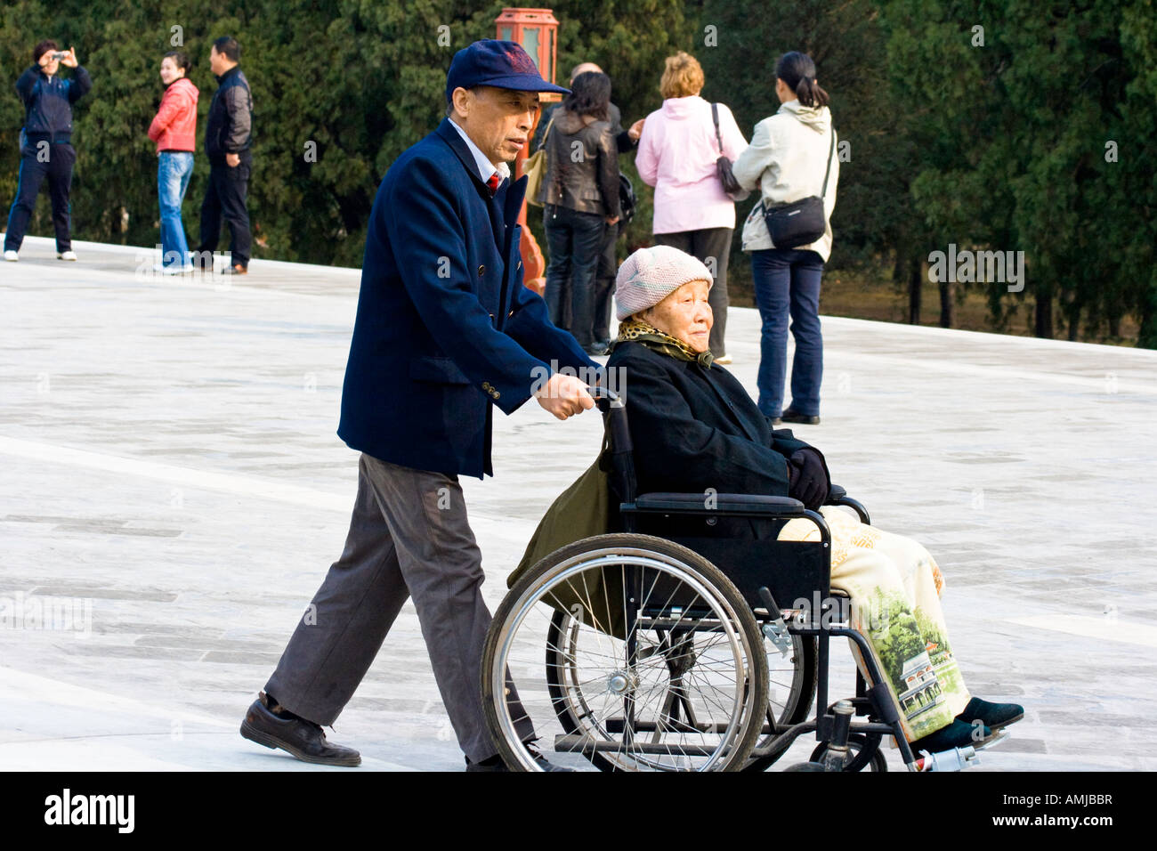 Elderly Man Pushing Aging Woman at a Park in Beijing China Stock Photo ...