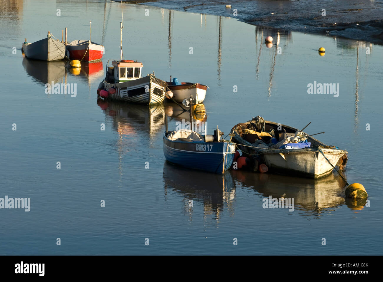 Tranquil scene Working boats Fishing trawlers Stock Photo - Alamy